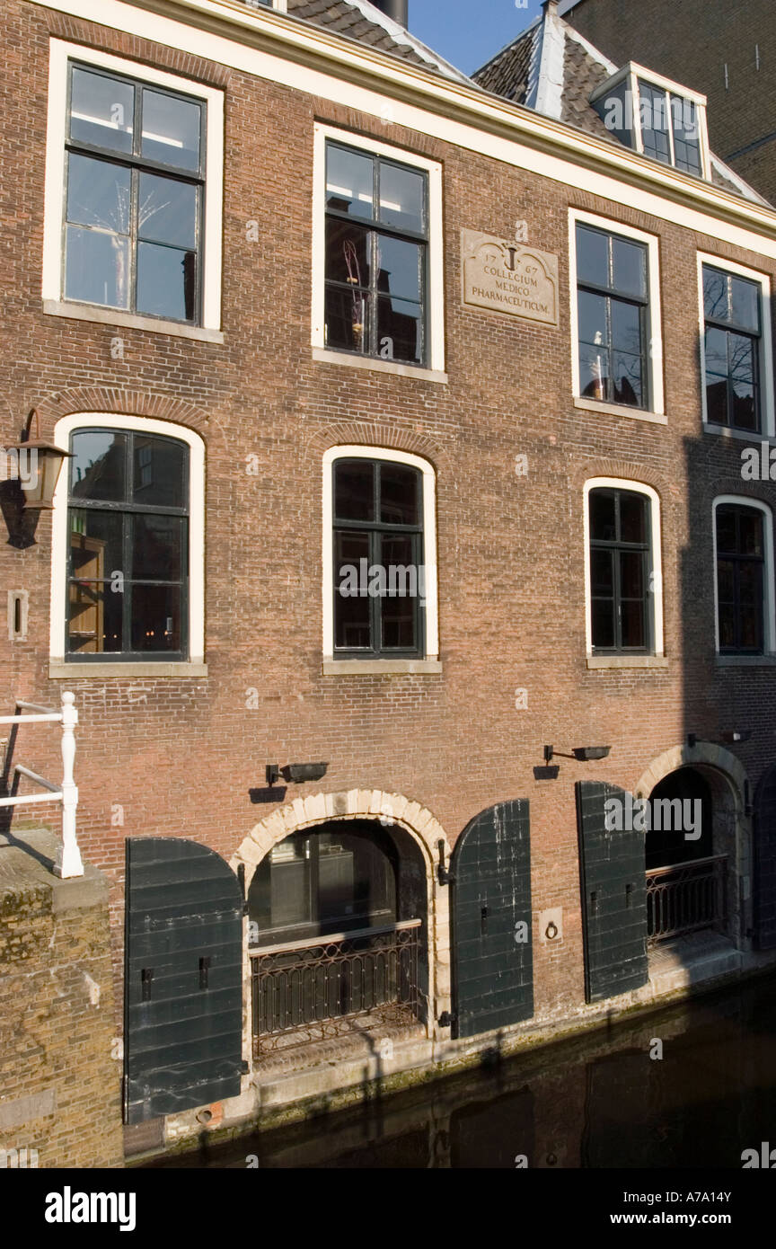 House ith black shutter window on the bank of canal in Delft South ...