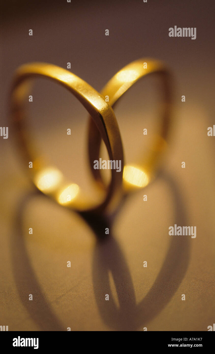 partnership symbol wedding rings vertical Stock Photo - Alamy