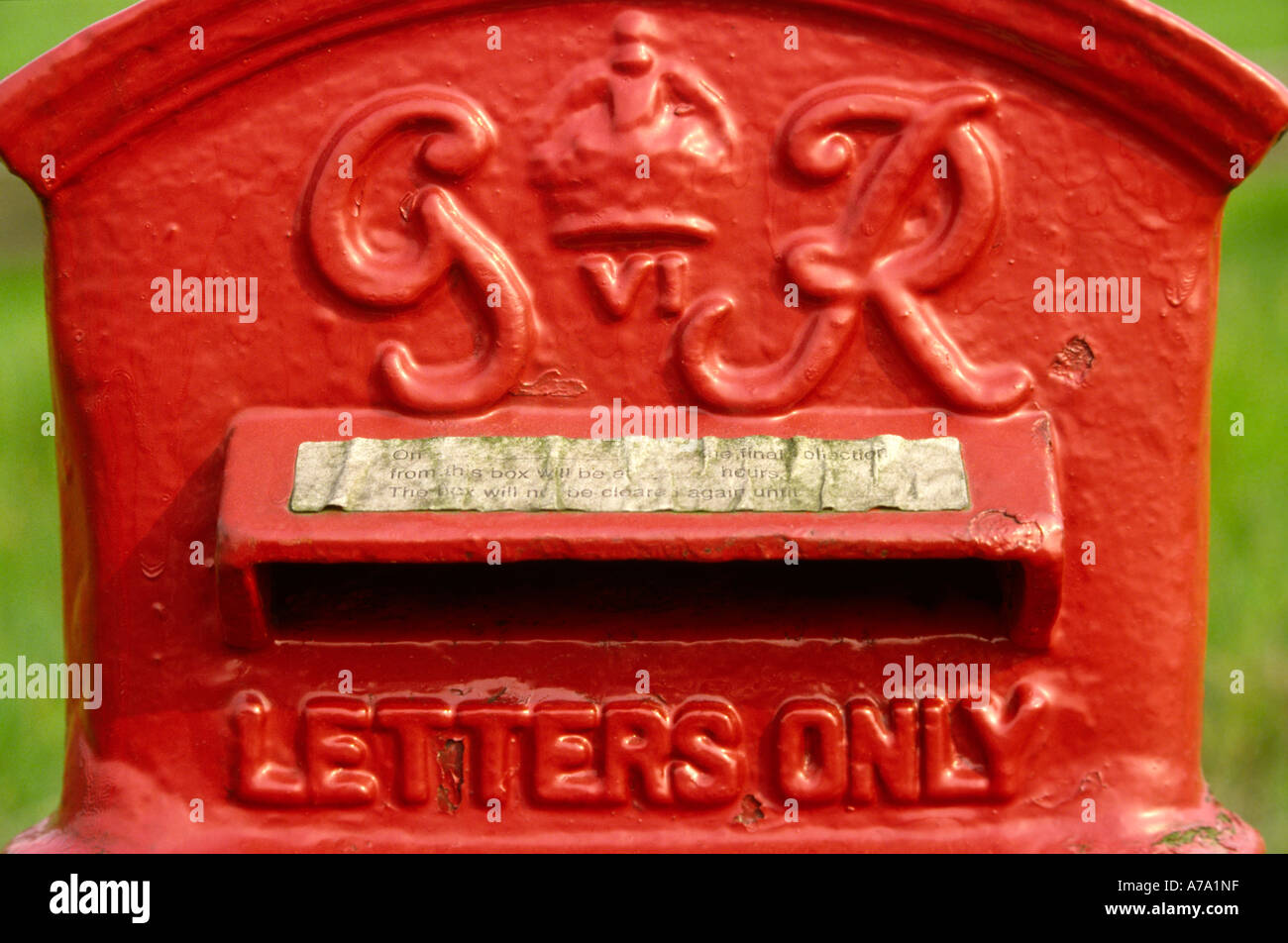 Communications top of George sixth curved Post Box Stock Photo - Alamy