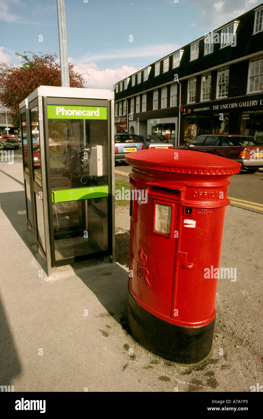 Cheshire Wilmslow Oval Post Box and modern phone boxes Stock Photo - Alamy