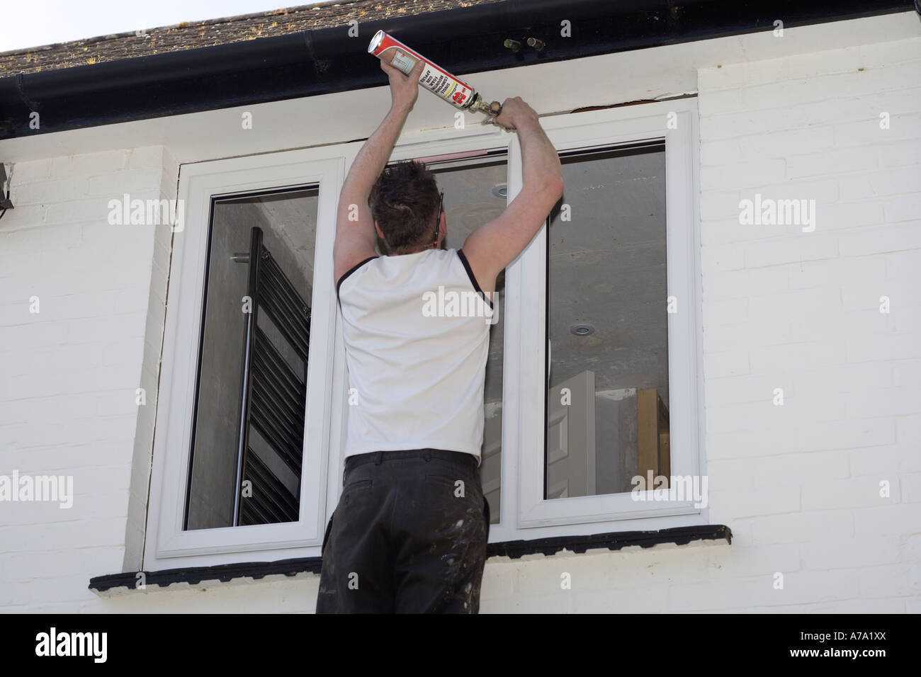 New PVC window being fitted to house Stock Photo - Alamy