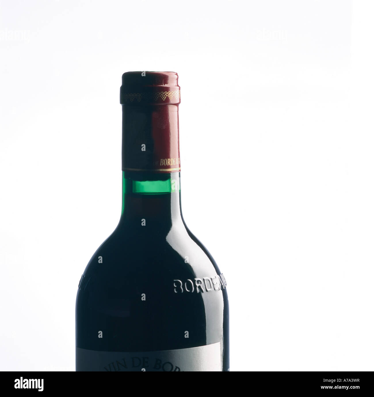 A dark red wine bottle takes center stage with a smooth and sleek cap ...