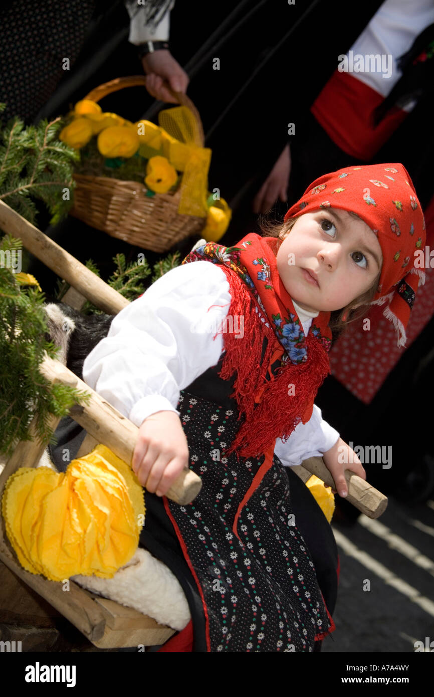 Child being carried on a chariot at the Bormio Easter parade ...