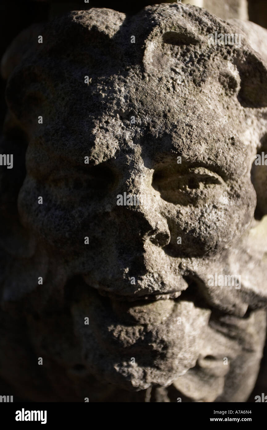 Carved stone face Stock Photo - Alamy