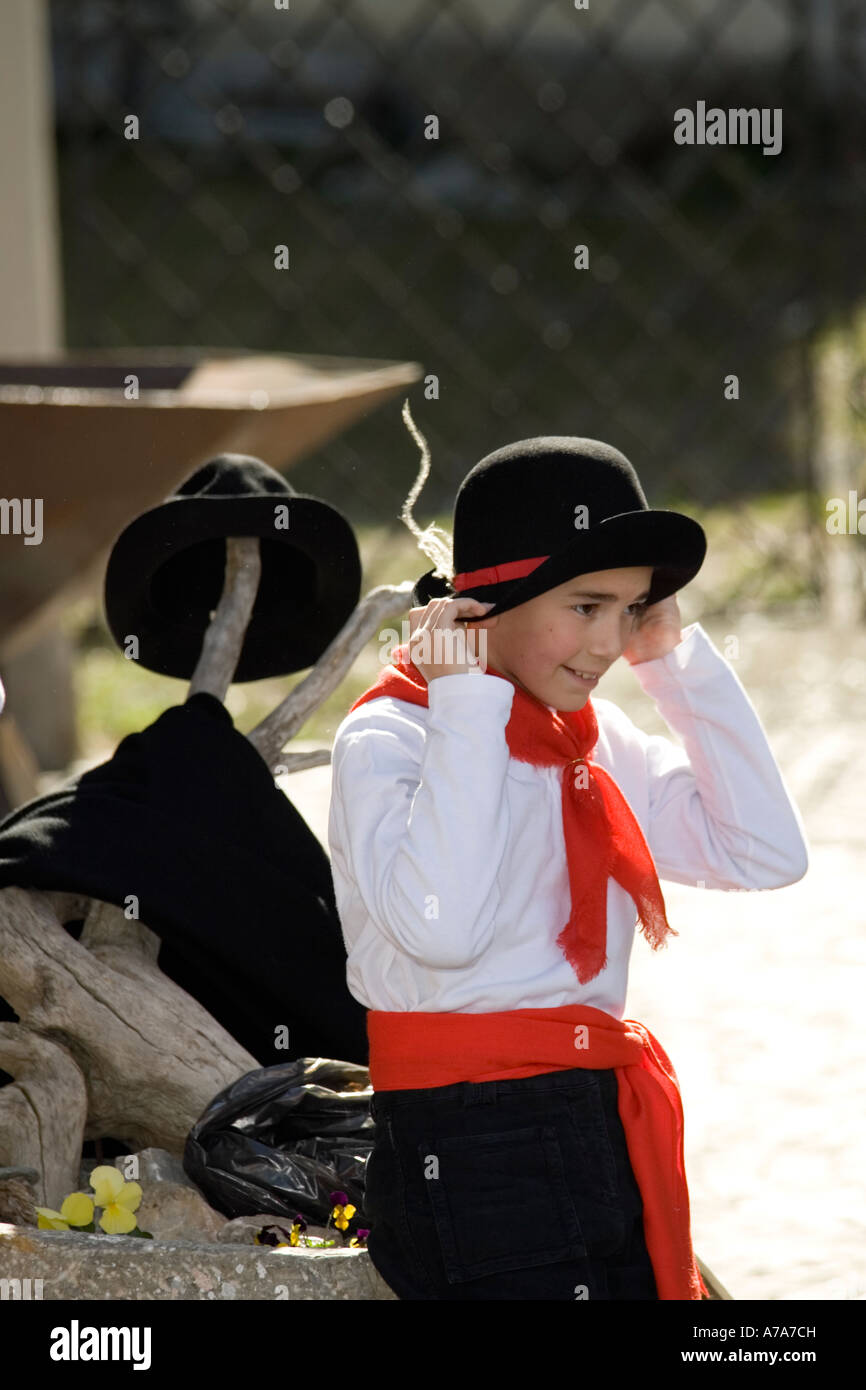 Young boy wearing the costume hat, Old shepherd. Bormio Easter parade ...