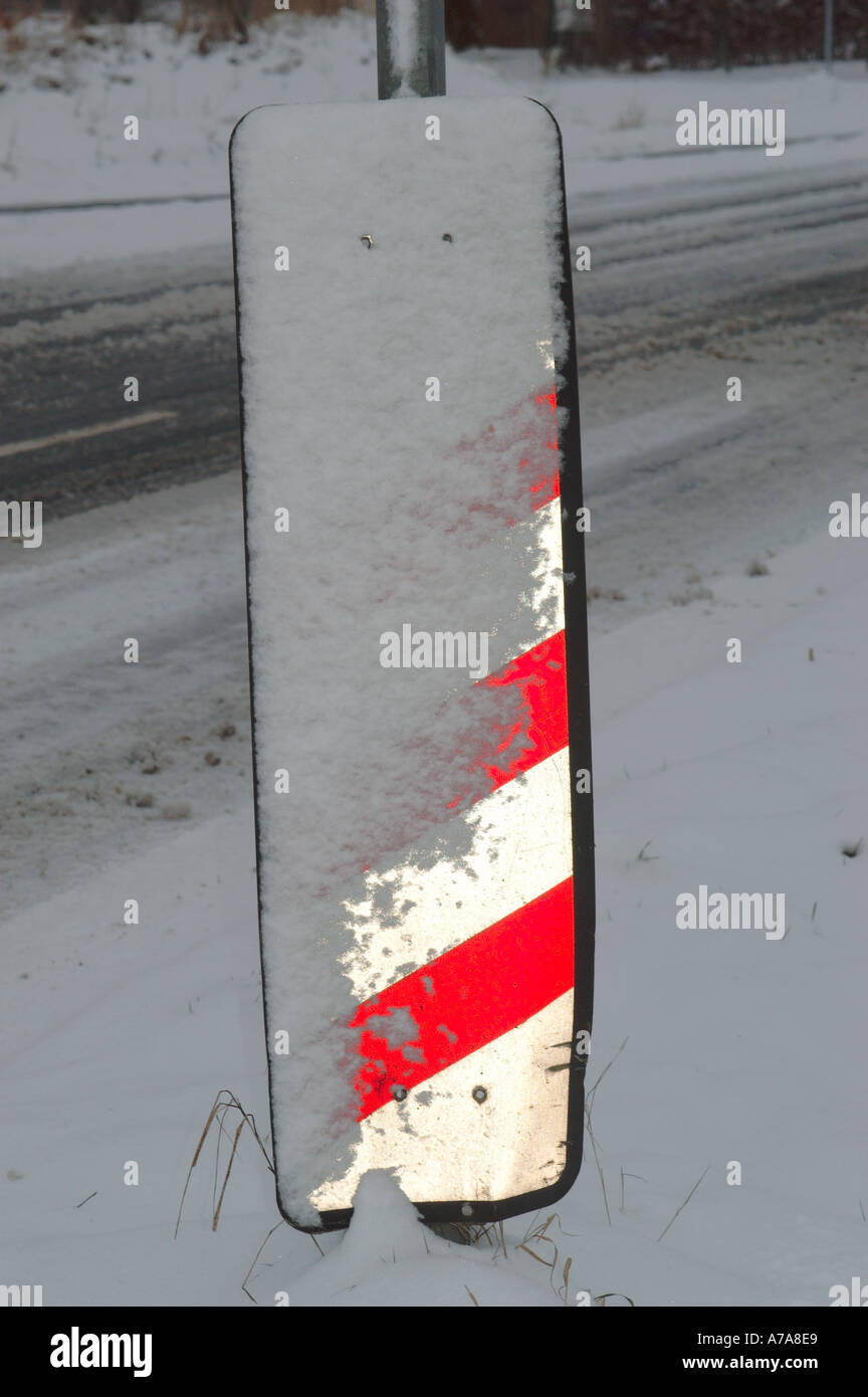 Snow on traffic sign Stock Photo - Alamy
