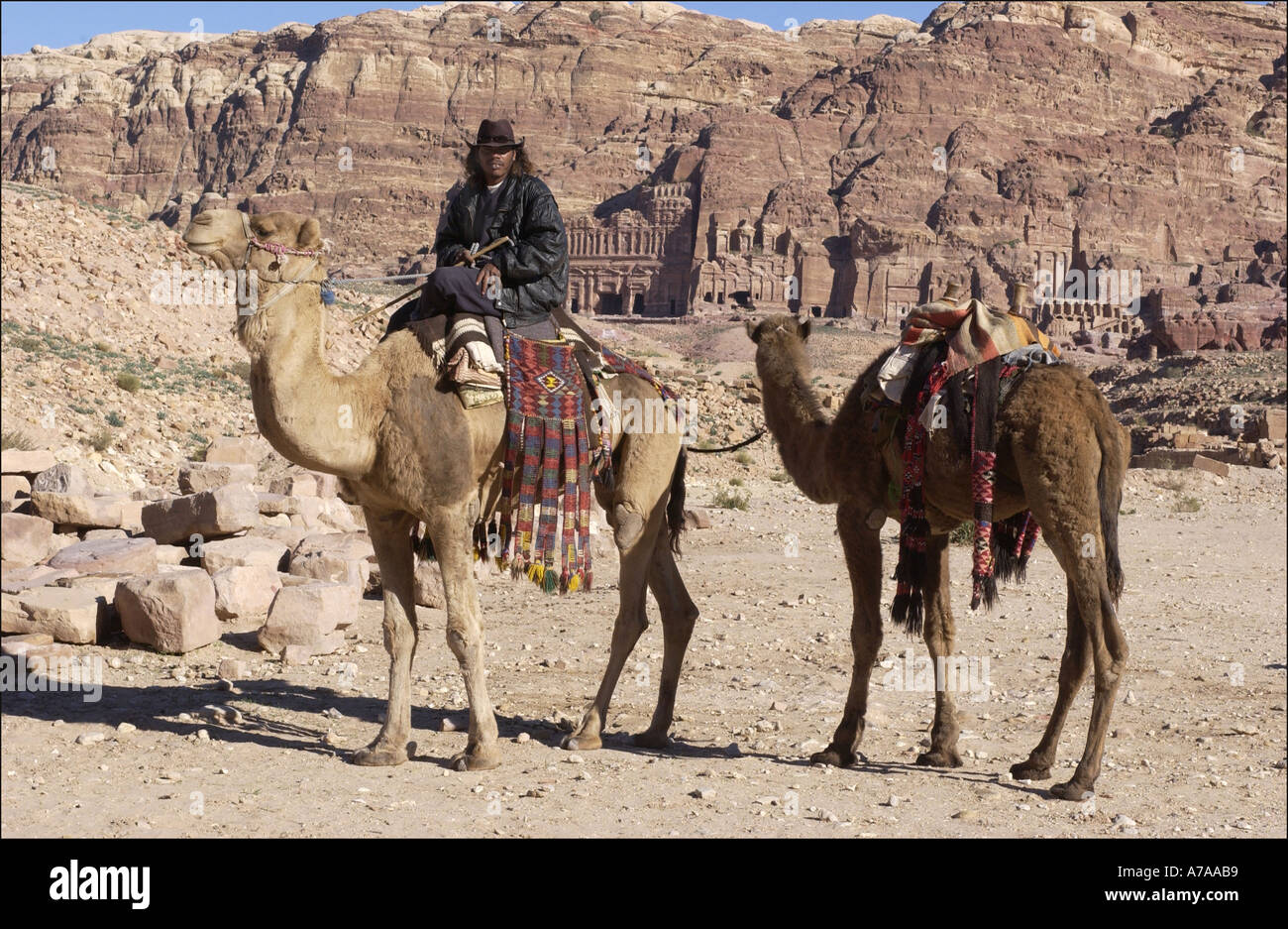 Jordanian Man and Camels in front of Palace Tombs, Petra Jordan Stock ...
