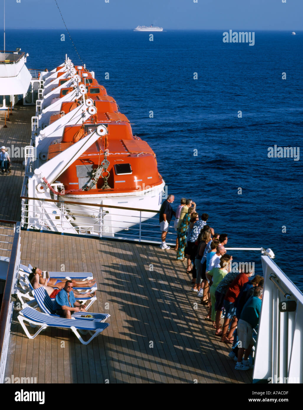 Cruise ship passengers at rail Stock Photo - Alamy