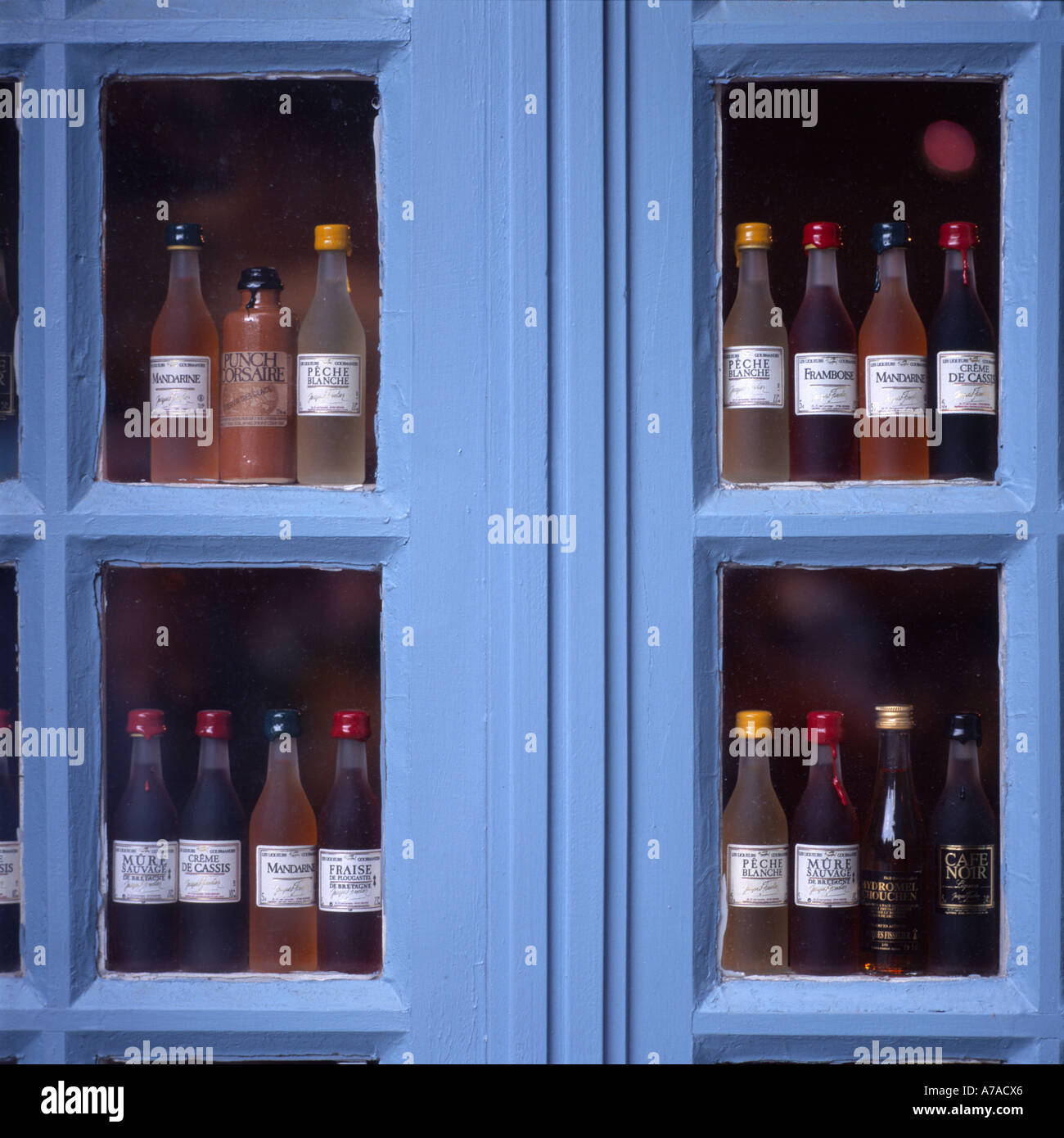 Bottles in Window / Locronan Stock Photo - Alamy