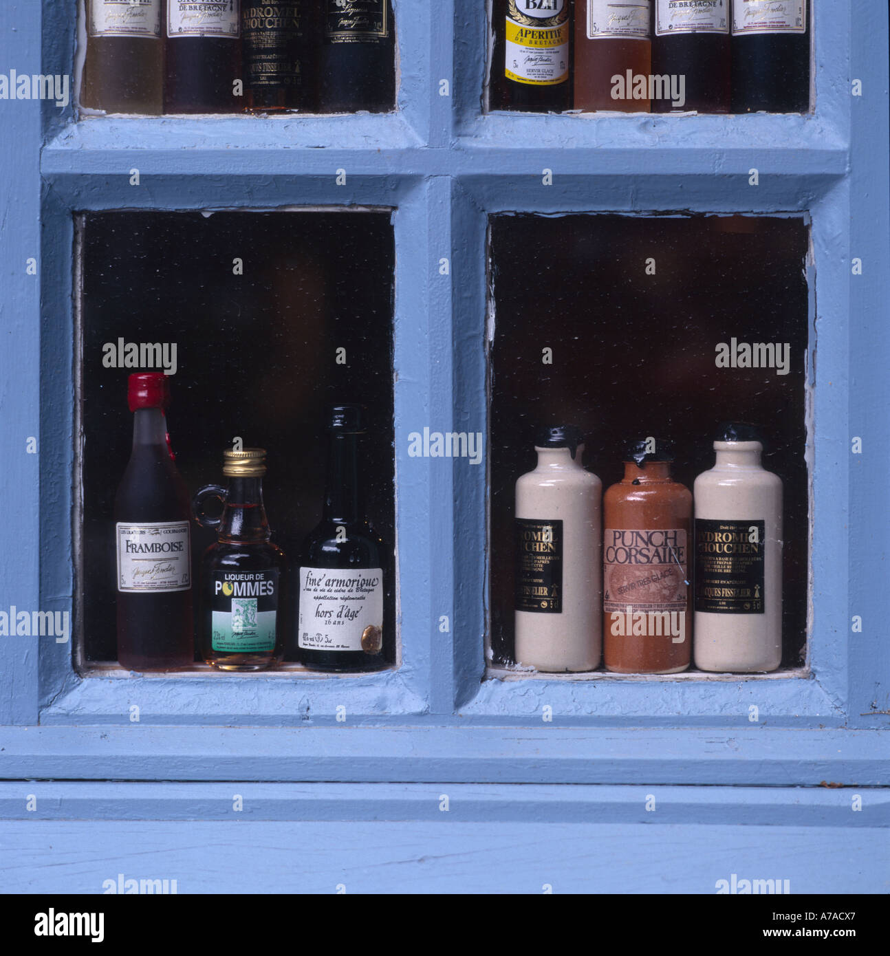 Bottles in Window / Locronan Stock Photo - Alamy