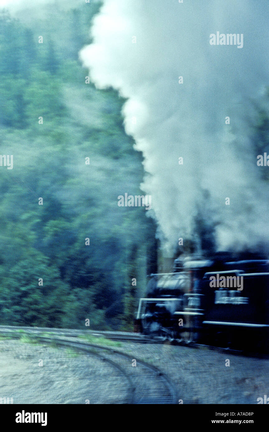 Steam Train Rounding a Bend in the Mountains Stock Photo - Alamy