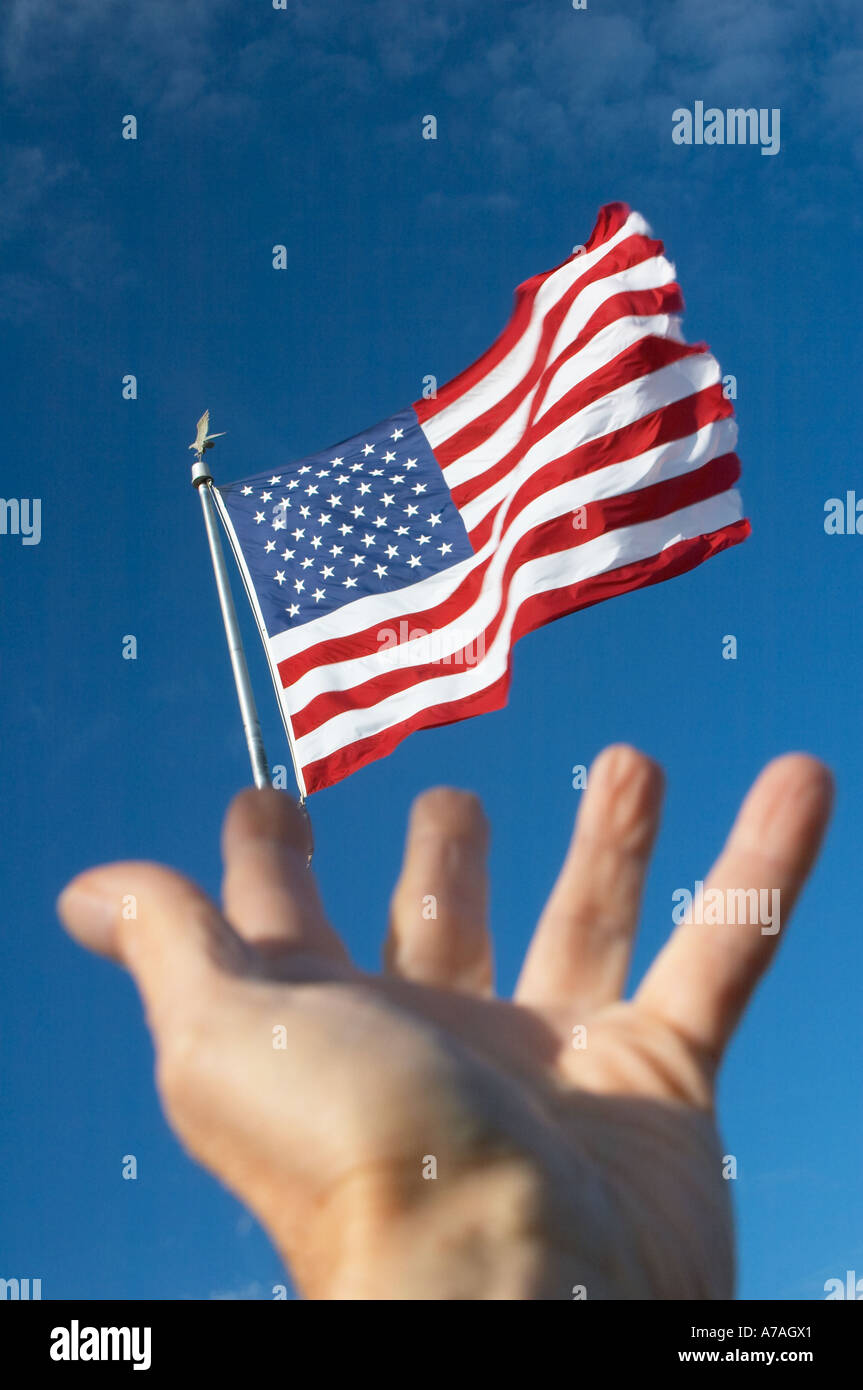 American Flag and Reaching Hand Stock Photo - Alamy