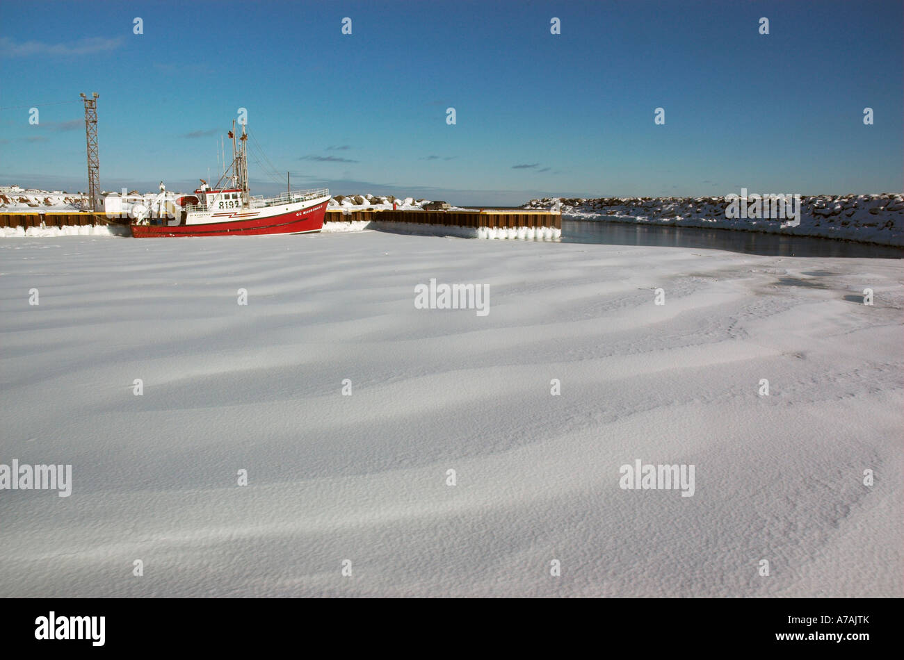 A trawler frozen into the ice at the fishing port of Ste Therese in ...