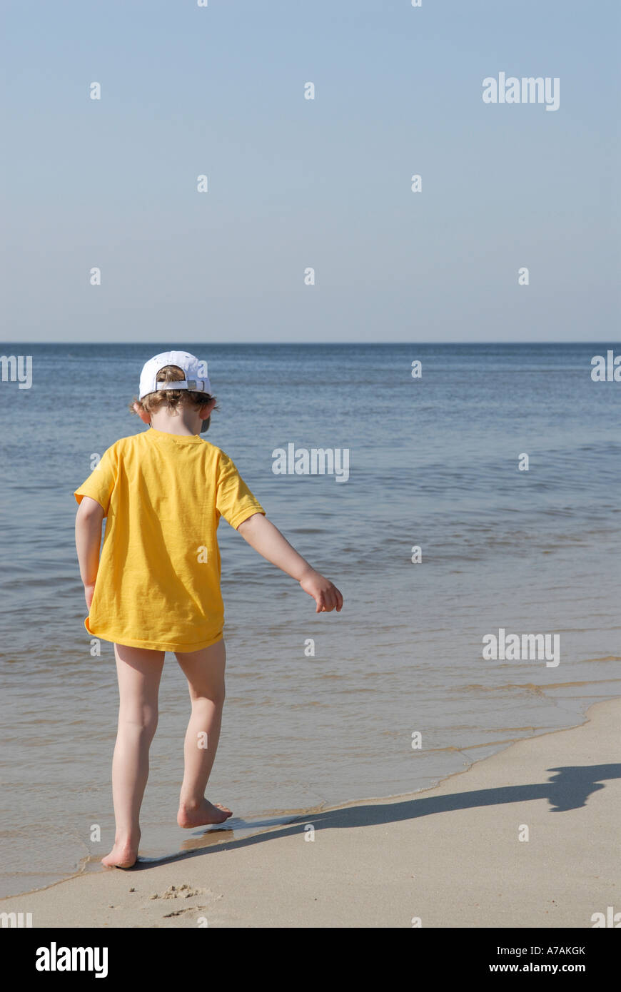 Boy On Beach Stock Photo - Alamy