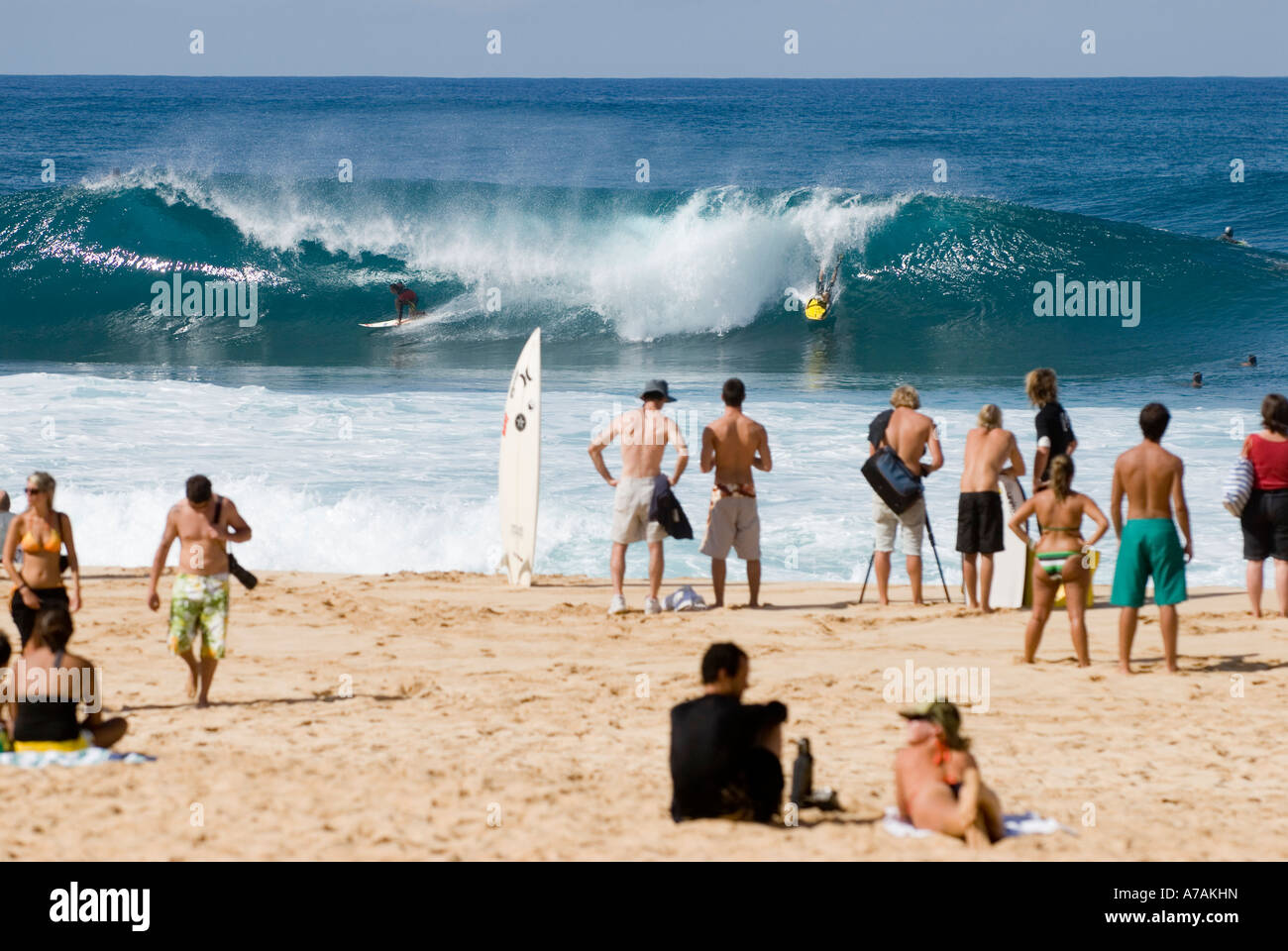Sightseers on beach watching the surfing action at Pipeline, North ...
