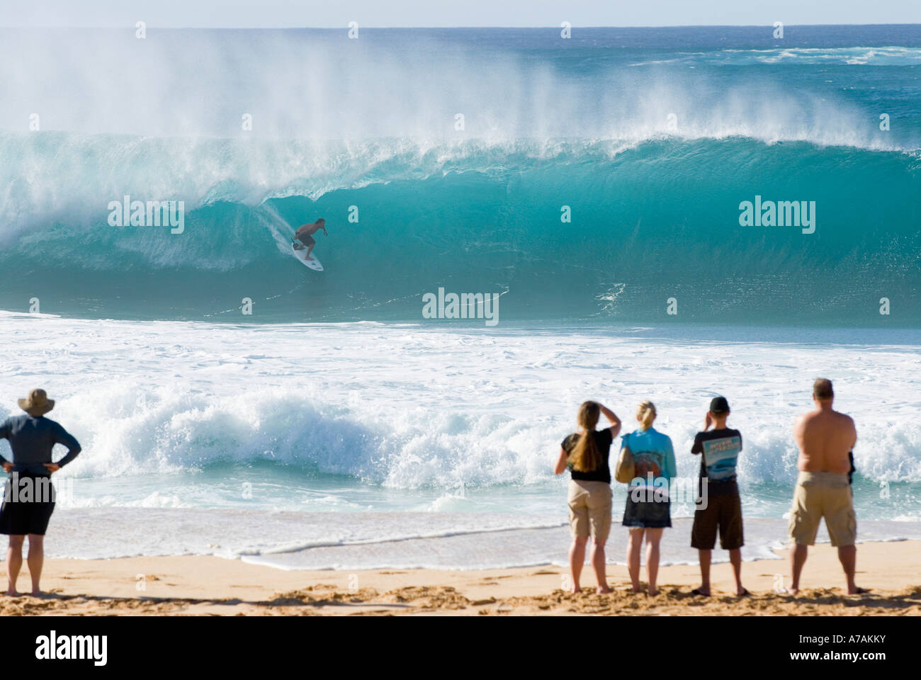 Sightseers on beach watching the surfing action at Pipeline, North ...