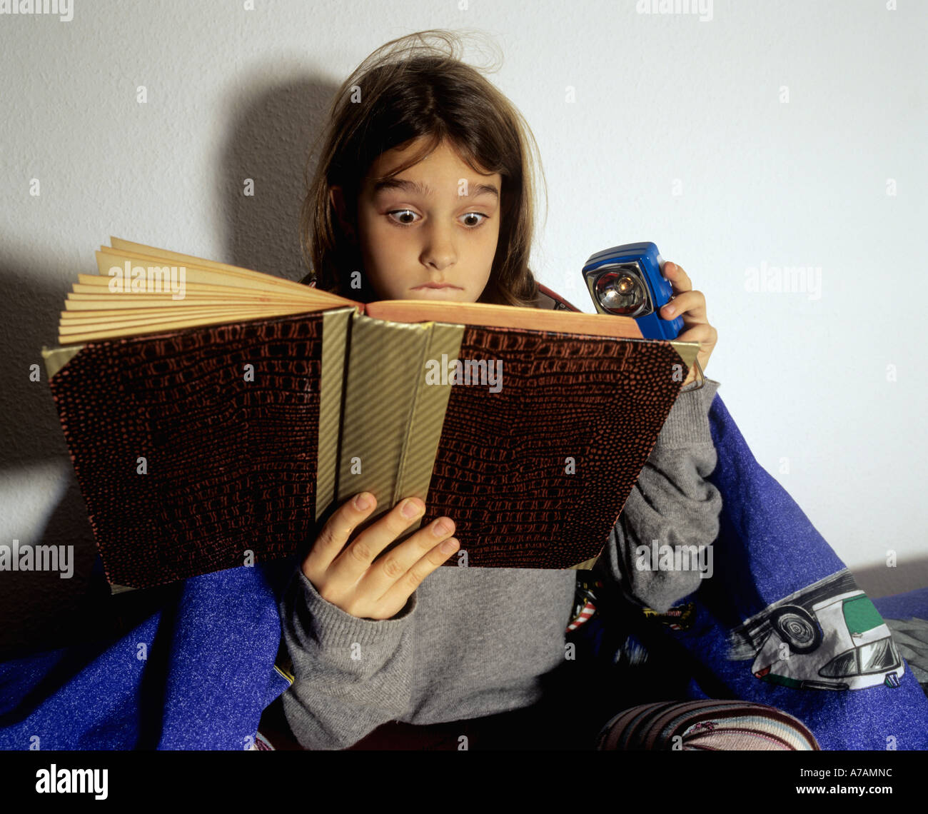Girl reading book at home 10 12 years hi-res stock photography and ...