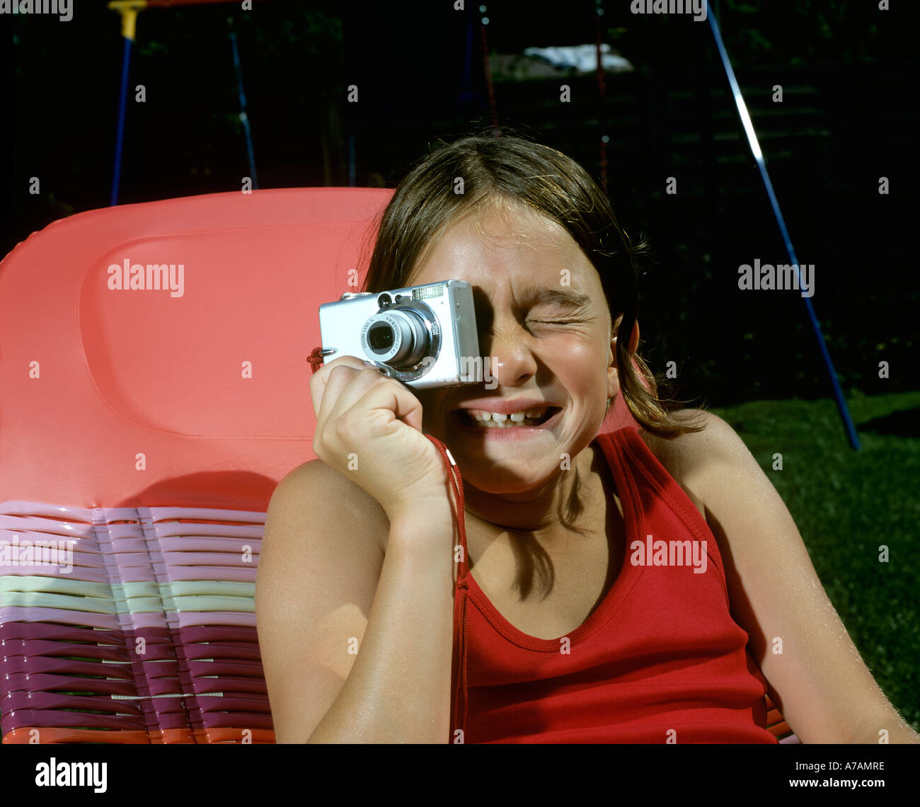 laughing girl having fun with digital camera Stock Photo - Alamy