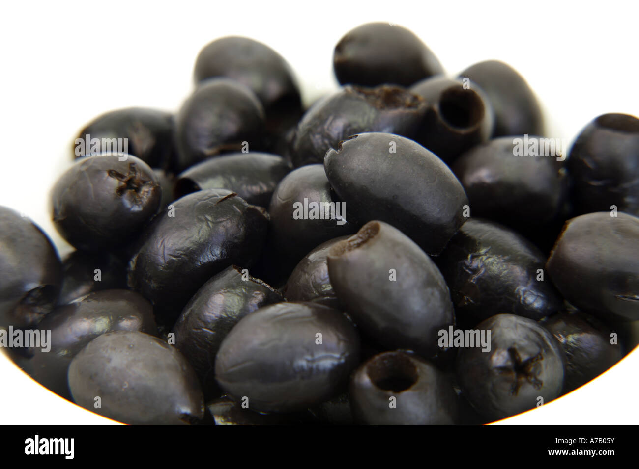 Bowl of Pitted Black Olives Stock Photo - Alamy