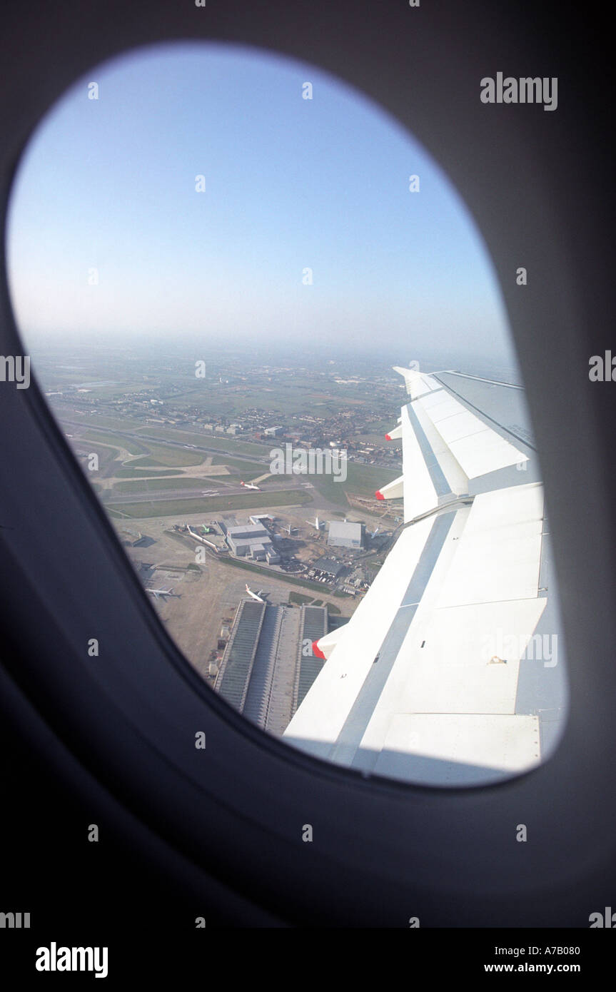 View through an aeroplane window after take off Stock Photo - Alamy