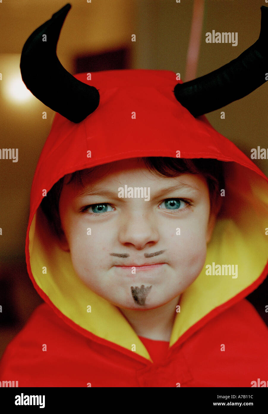 small boy dressed up as the devil with cape and horns Stock Photo - Alamy