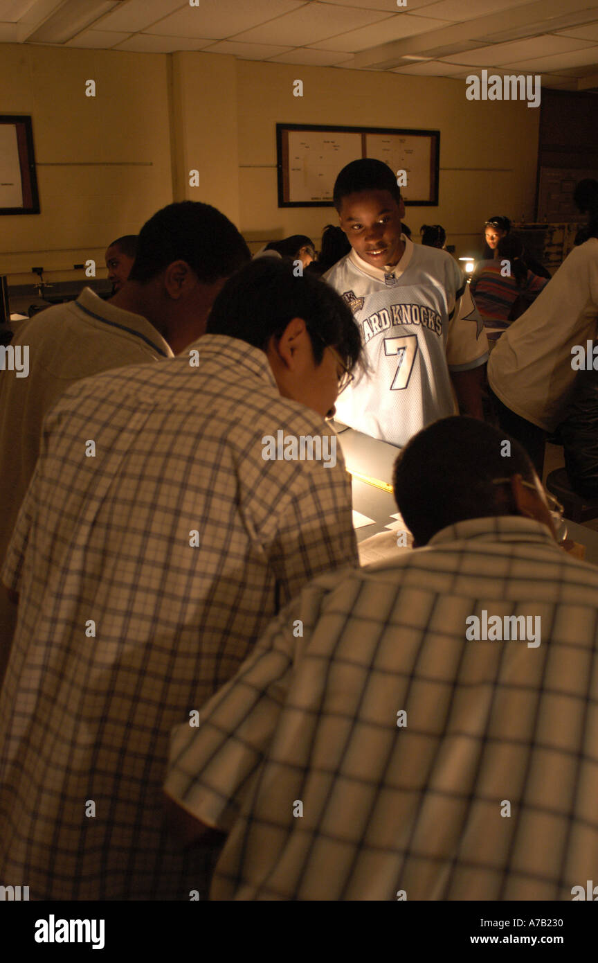 Students working on an optics experiment in a physics class room Stock ...