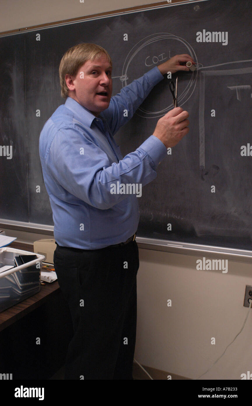 Science teacher lecturing at blackboard Stock Photo - Alamy