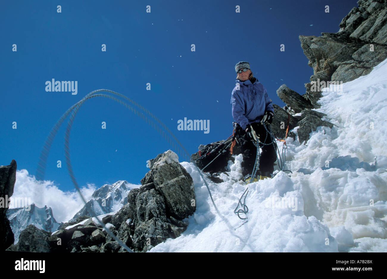 Polly Murray, mountaineer and explorer, throwing down climbing rope ...
