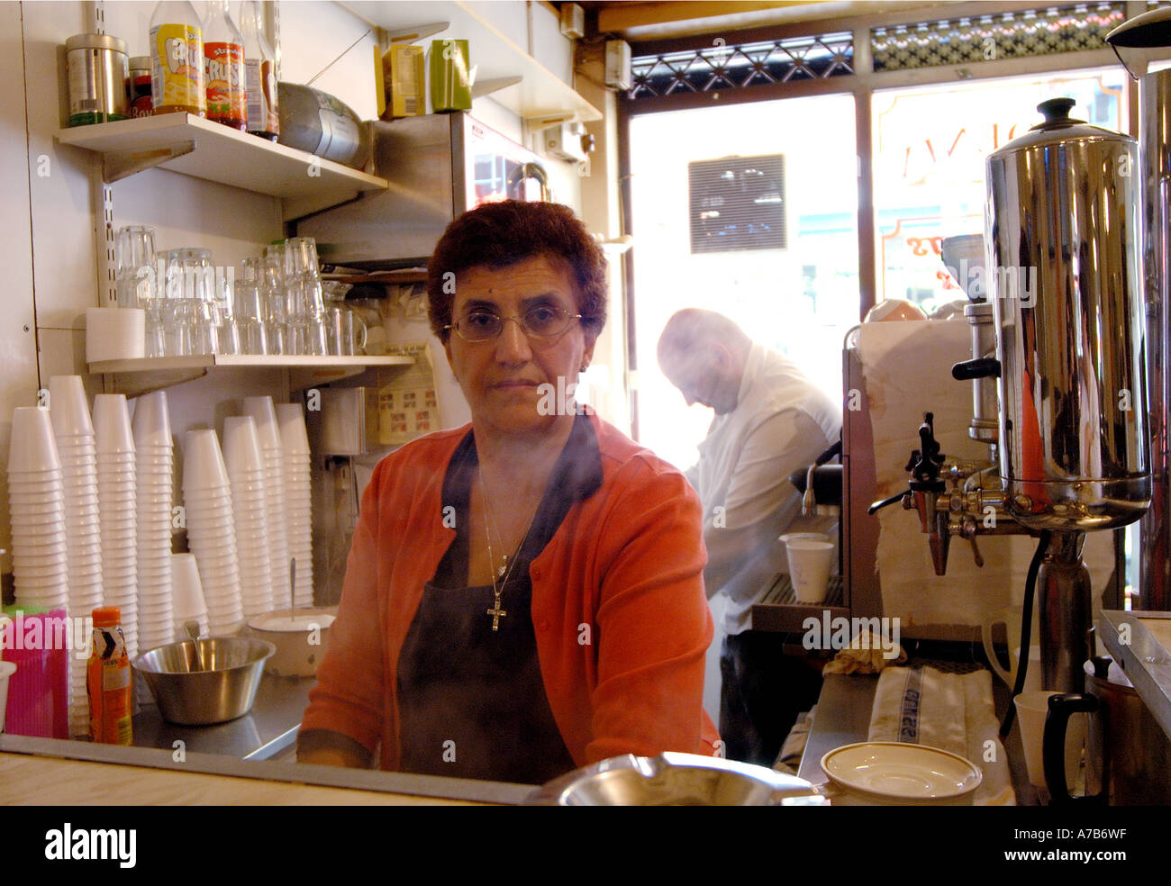 Old woman serving food cafe hi-res stock photography and images - Alamy