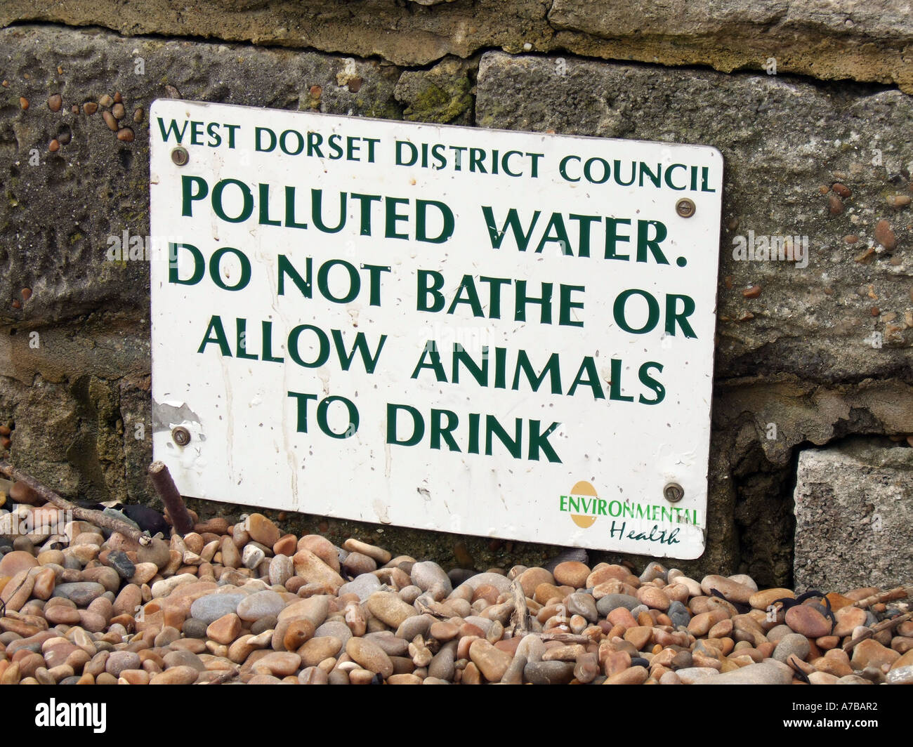 Polluted water warning sign at Seatown beach in Dorset Britain UK Stock ...