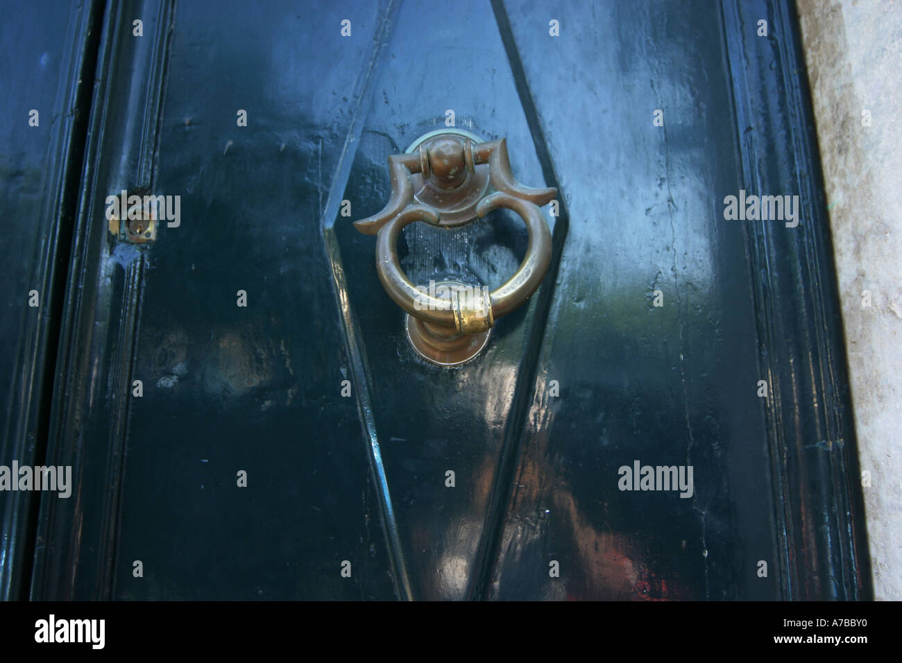 Heavy front door with metallic handle Stock Photo - Alamy
