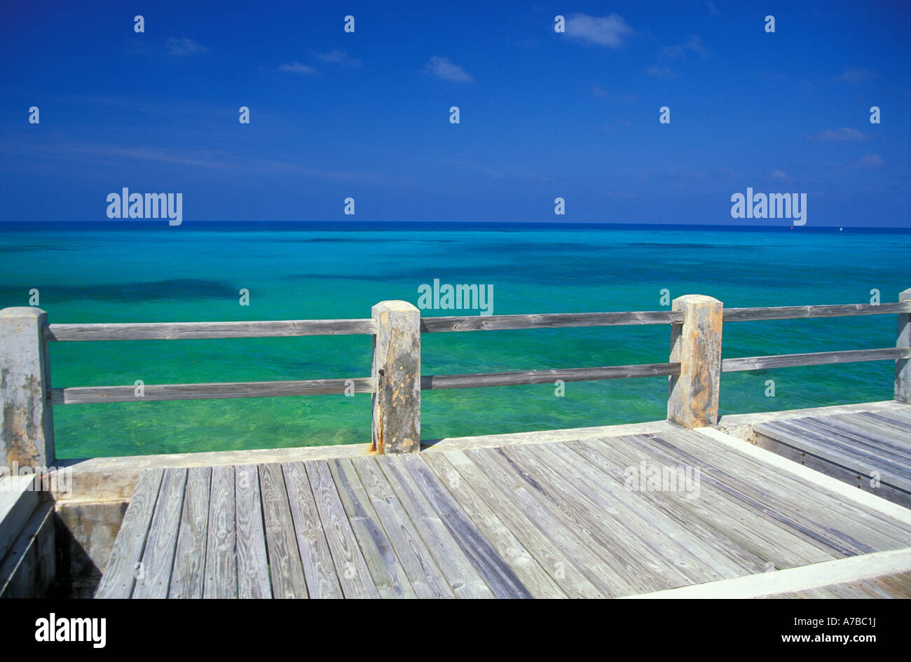 wooden dock and railing over azure sea in Bermuda Stock Photo - Alamy