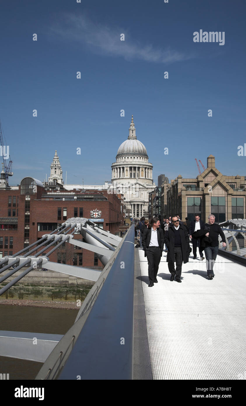 People walking across Millennium Bridge London Stock Photo - Alamy