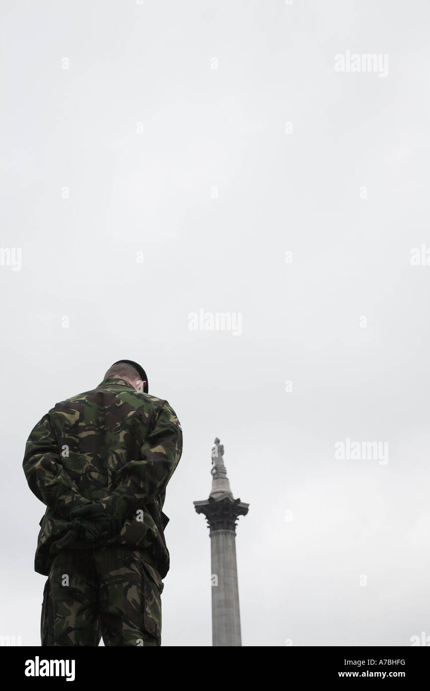 Soldier standing in front of Nelsons Column, Trafalgar Square, London ...