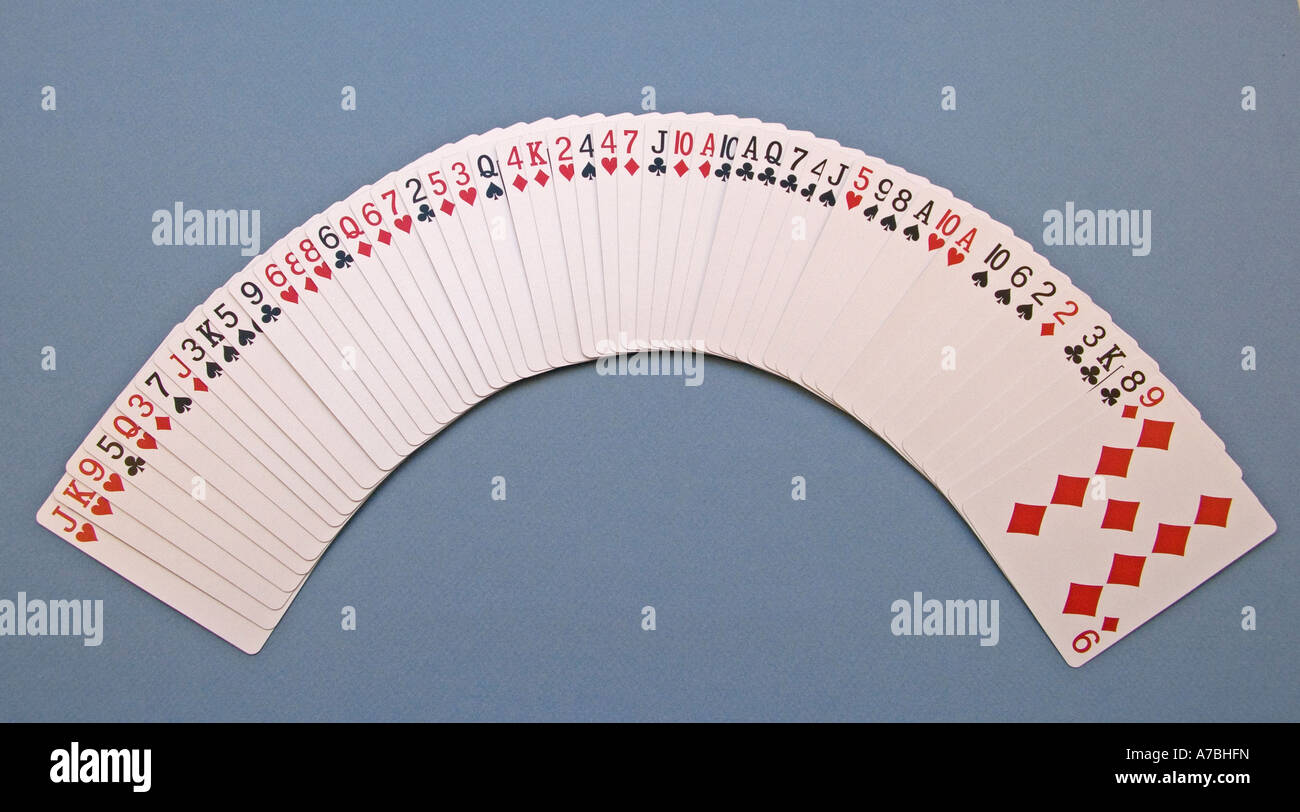 playing cards on a table Stock Photo - Alamy