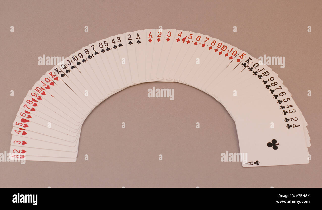 playing cards on a table Stock Photo - Alamy