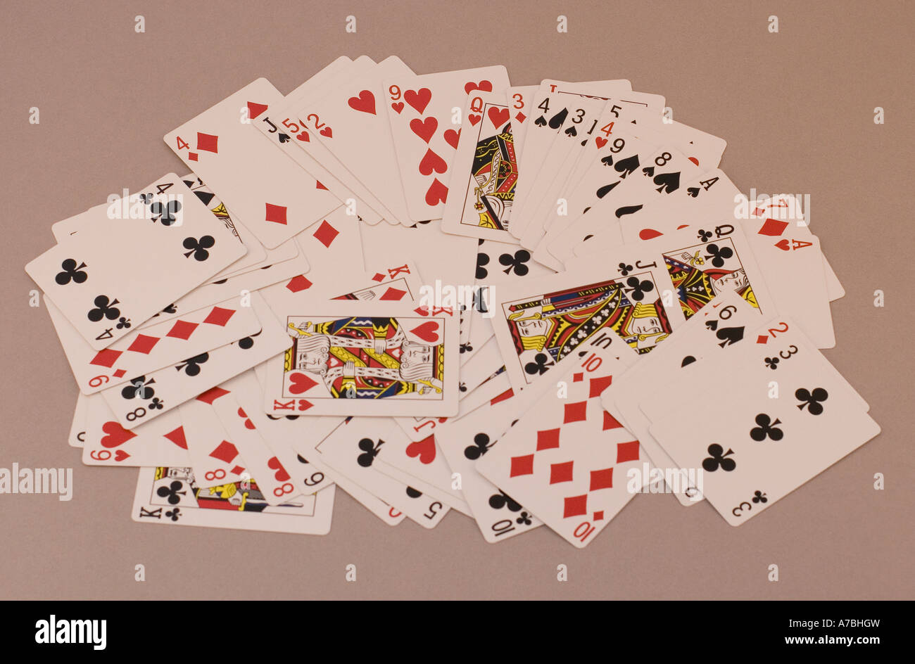 playing cards on a table Stock Photo - Alamy