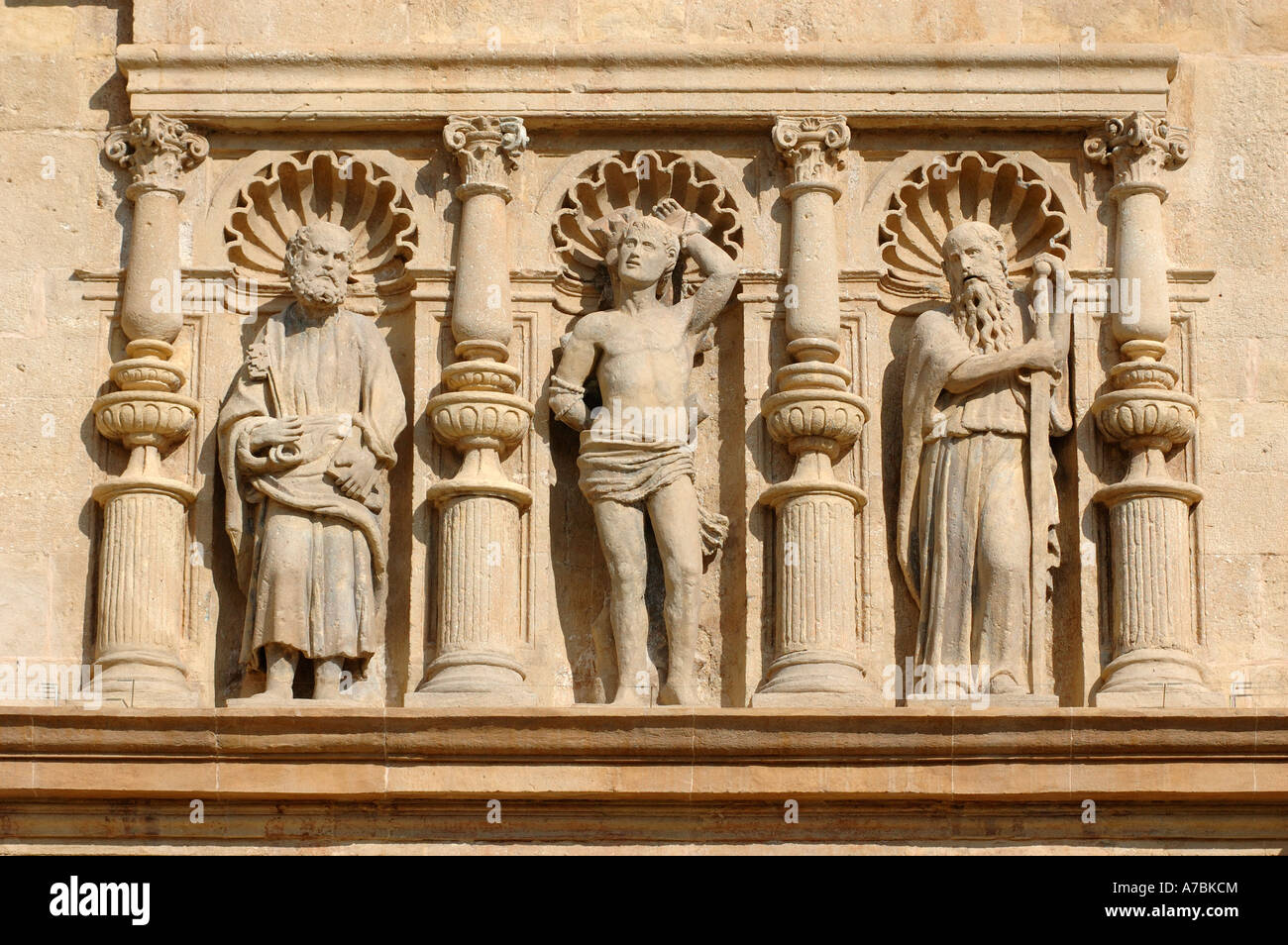Religious figures carved in stone on wall of San Sebastian church ...