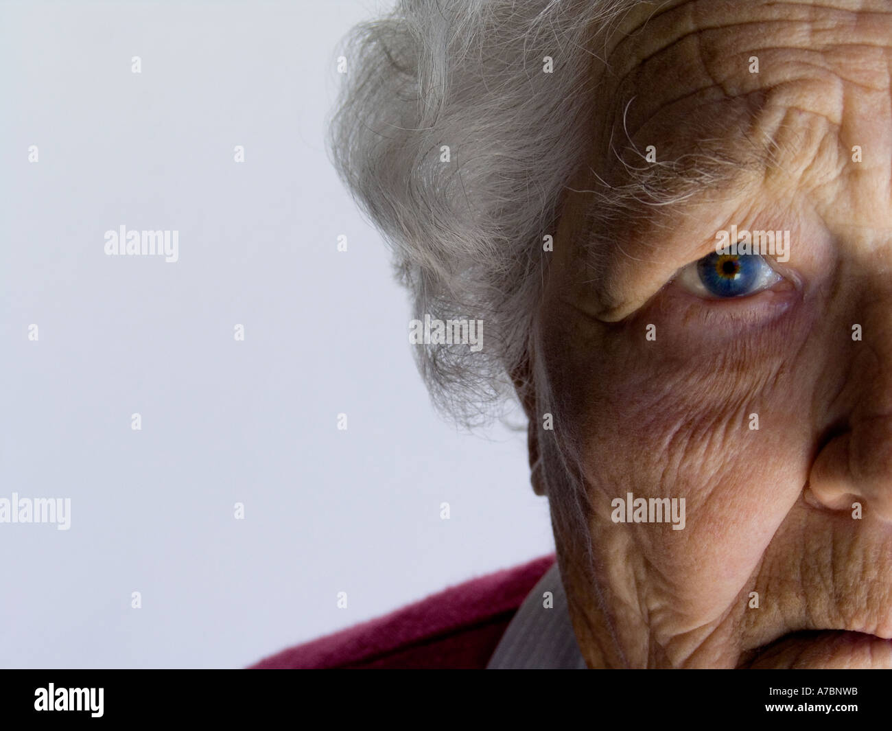 Elderly old senior lady half face age ageing eye isolating vulnerable ...