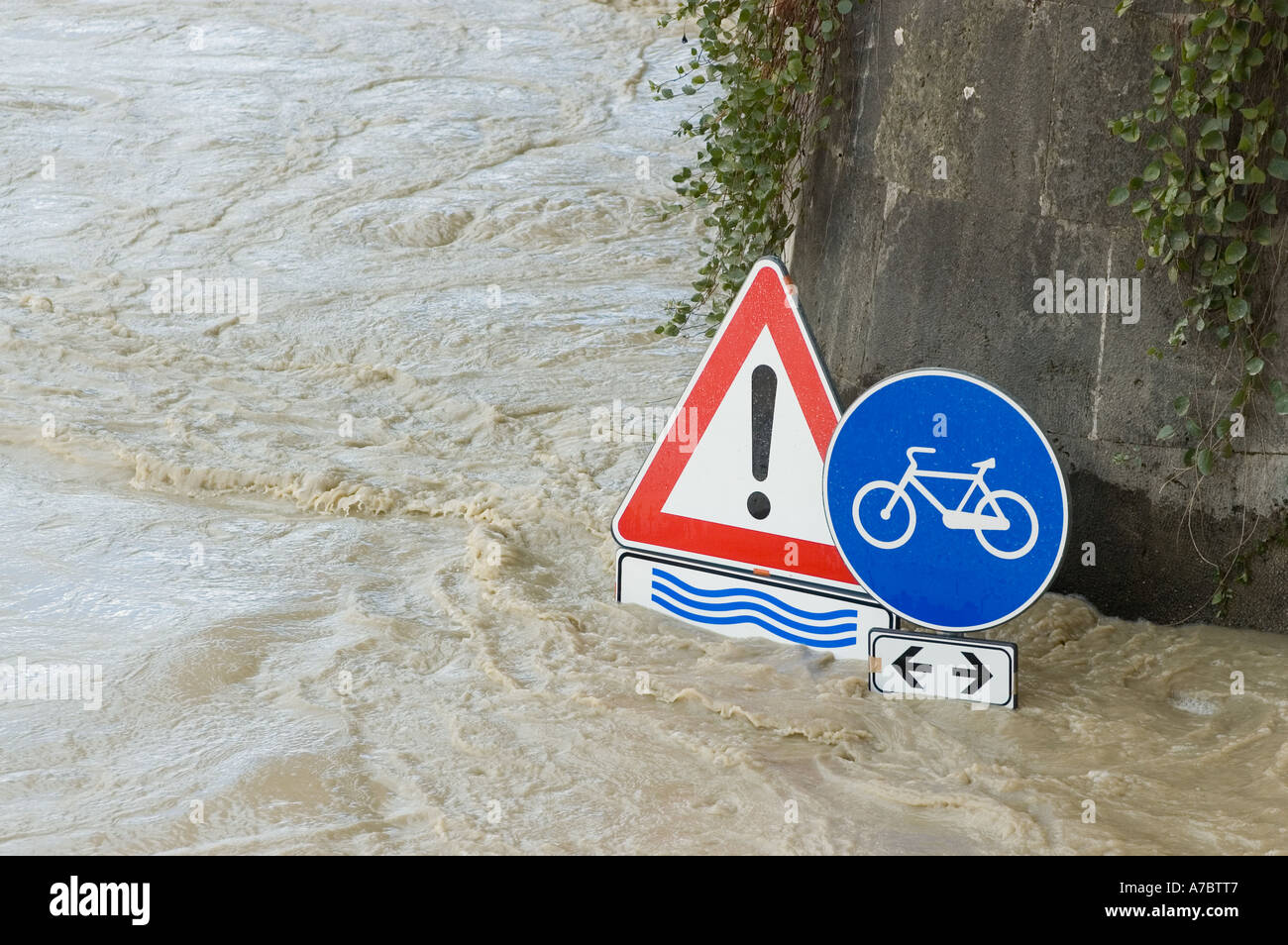 flooded bicycle sign and exclamation mark sign Stock Photo - Alamy