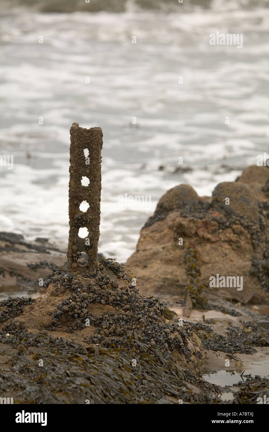 Rusting Victorian beach defence support strut Stock Photo - Alamy