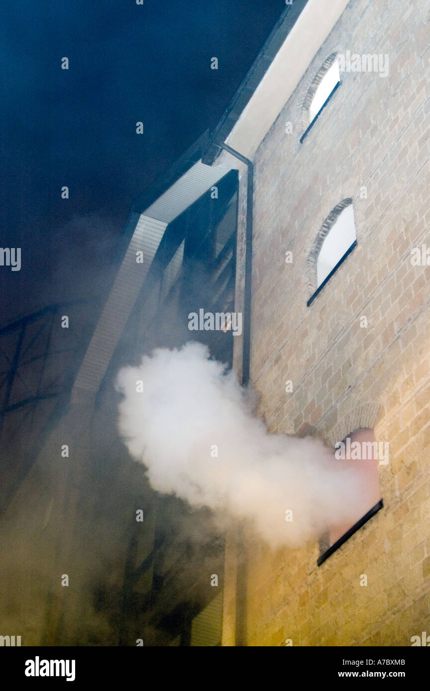 Smoke issuing from first floor window of a house on fire Stock Photo ...