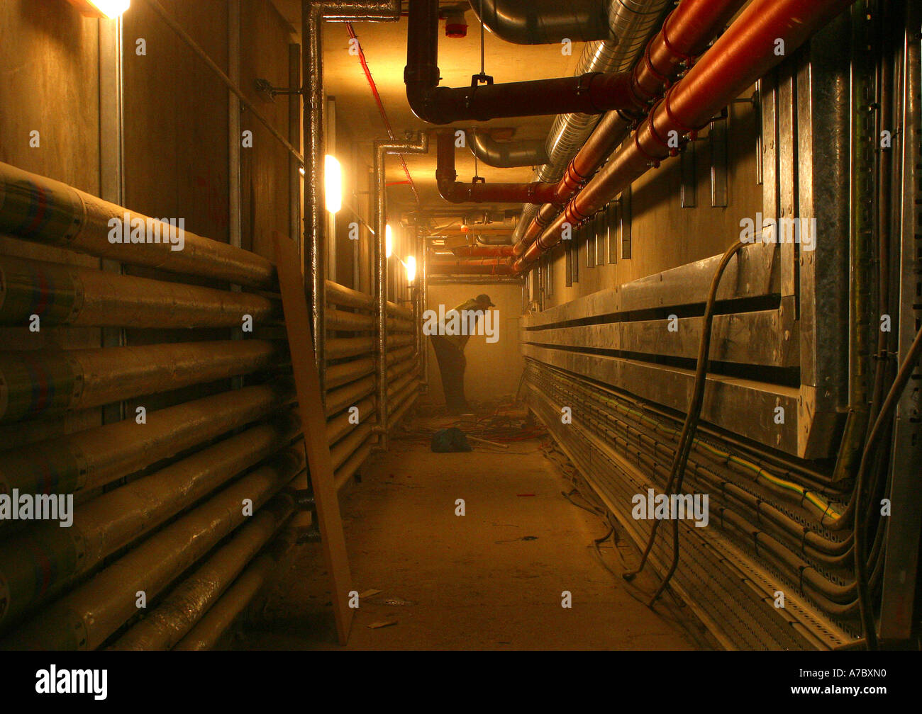 Basement corridor lined with boiler pipes Stock Photo - Alamy
