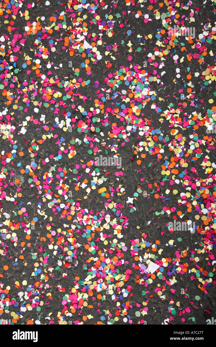 confetti on the road after carnival parade Stock Photo - Alamy
