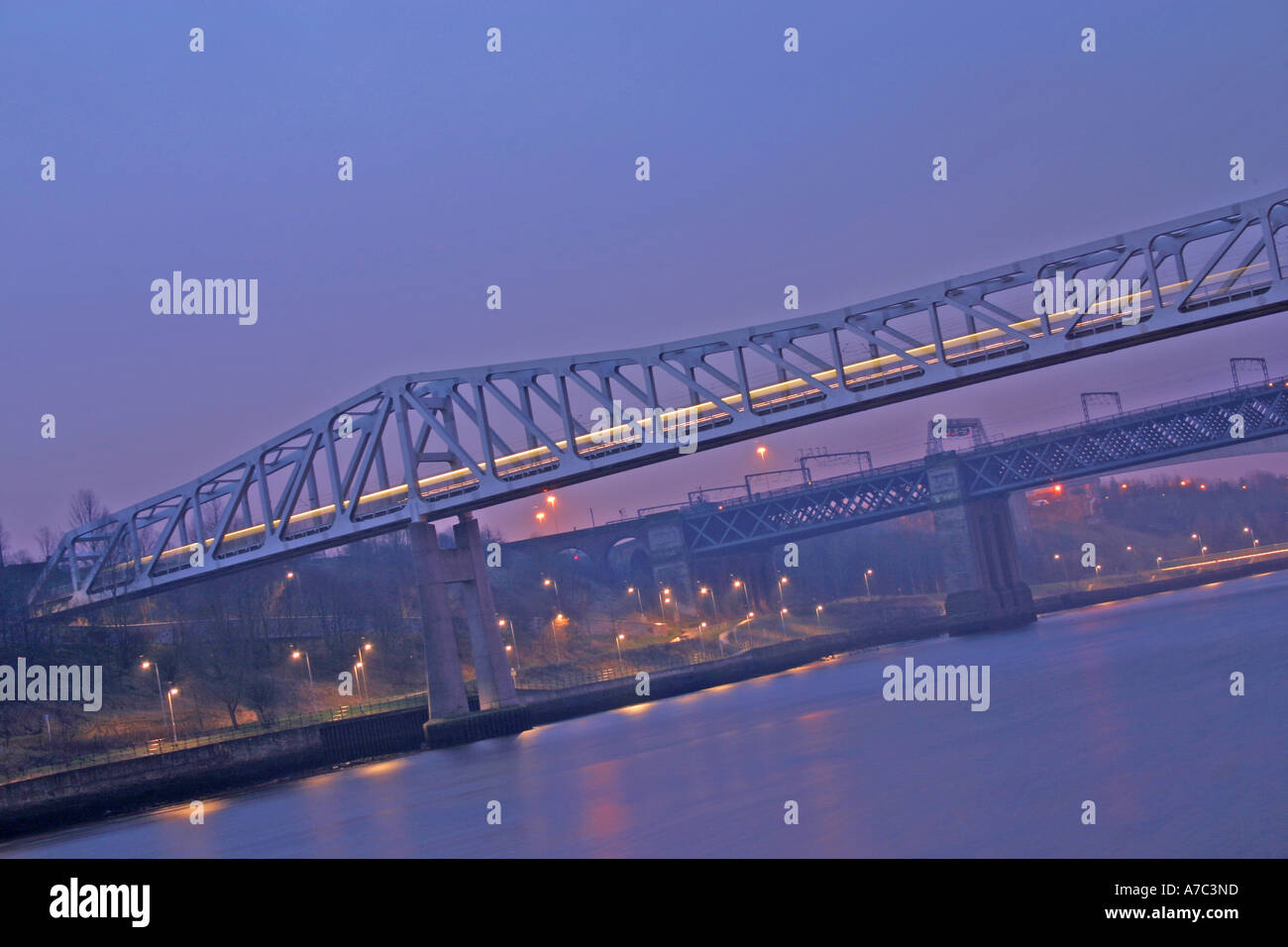 Train crossing the Queen Elizabeth Bridge sunrise the King Edward ...