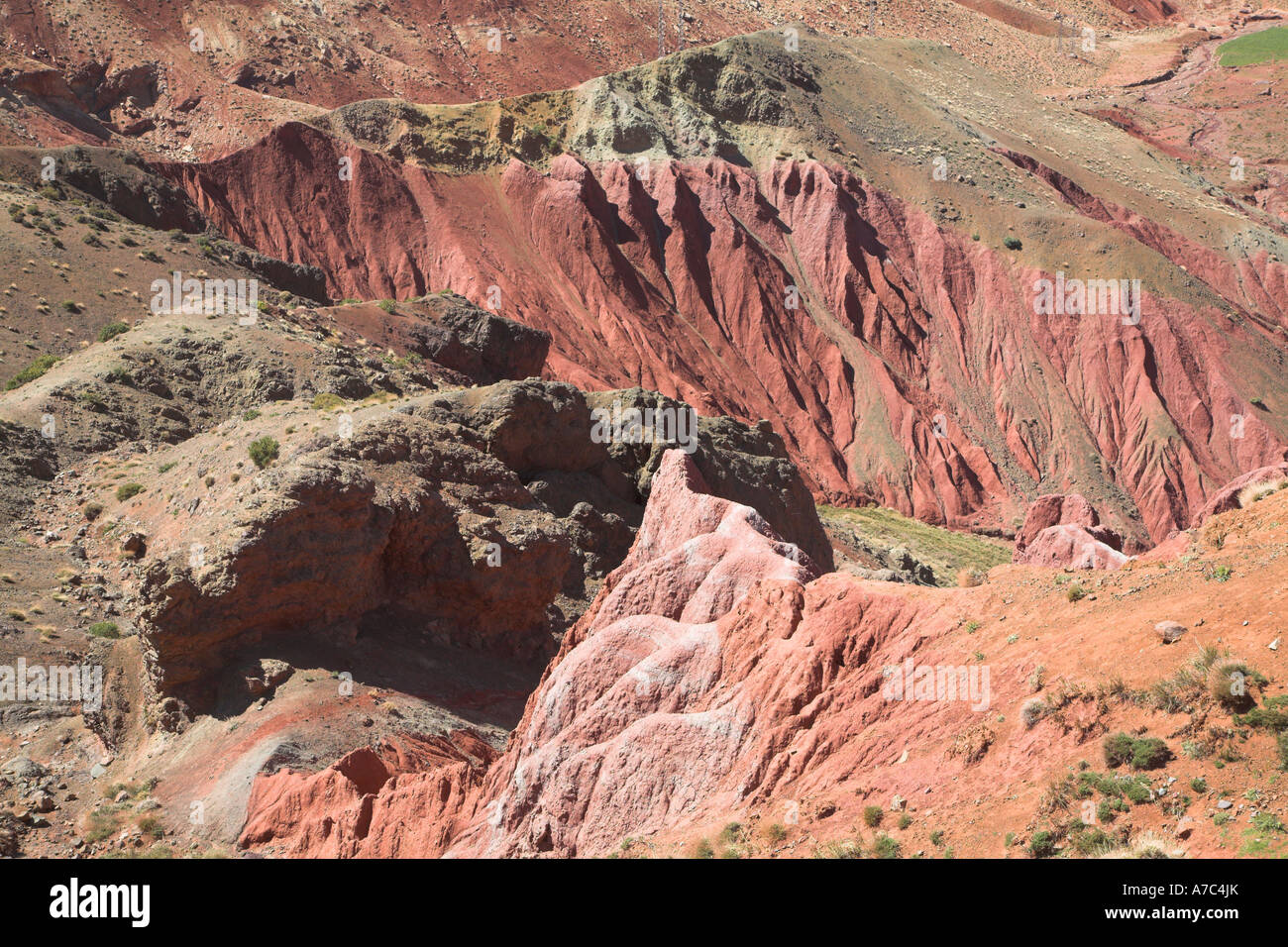Red rock geology exposed by gulley erosion High Atlas Mountains Morocco ...