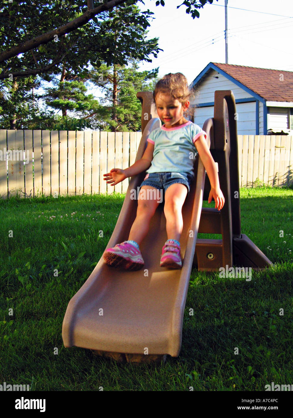 Child On her Garden Slide 1 Stock Photo - Alamy