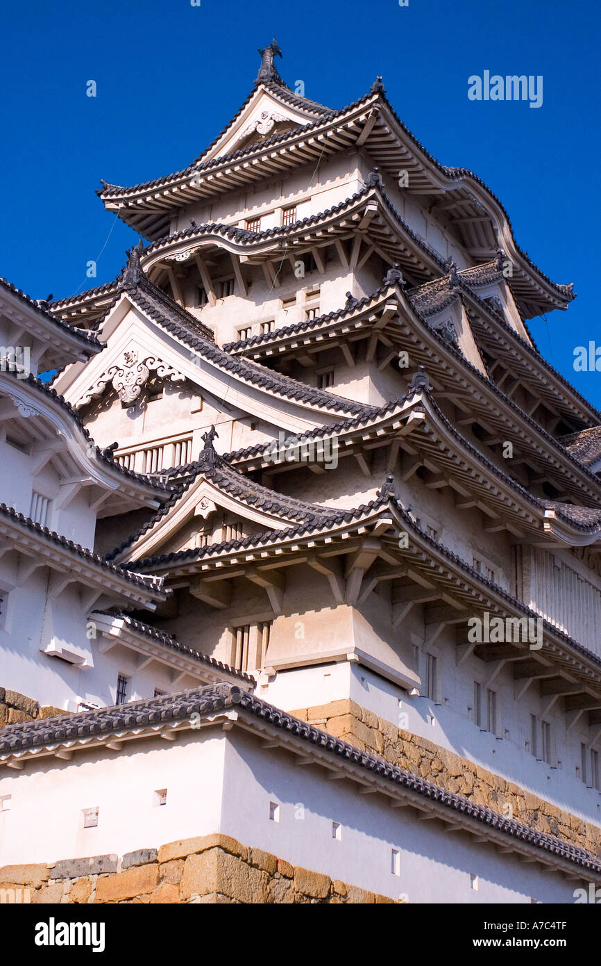 The enchanting multi storey castle of Himeji during cherry blossom ...