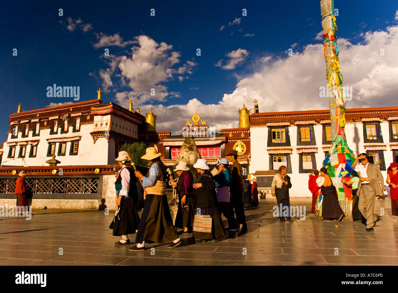 Monks pilgrim and tourist in front of the Jhokang temple in old Lhasa ...