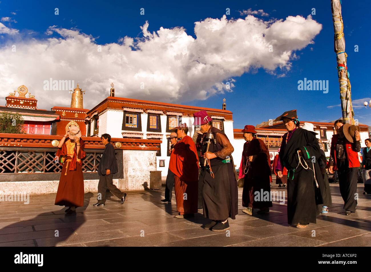 Monks pilgrim and tourist in front of the Jhokang temple in old Lhasa ...